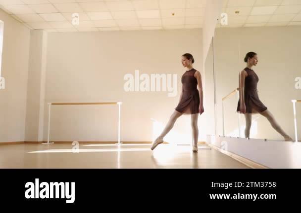 Beautiful teen girl, ballet dancer training, dancing on pointe at dance ...