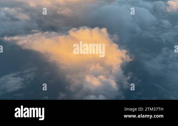 Cumulus clouds in orange rays Stock Videos & Footage - HD and 4K Video Clips - Alamy