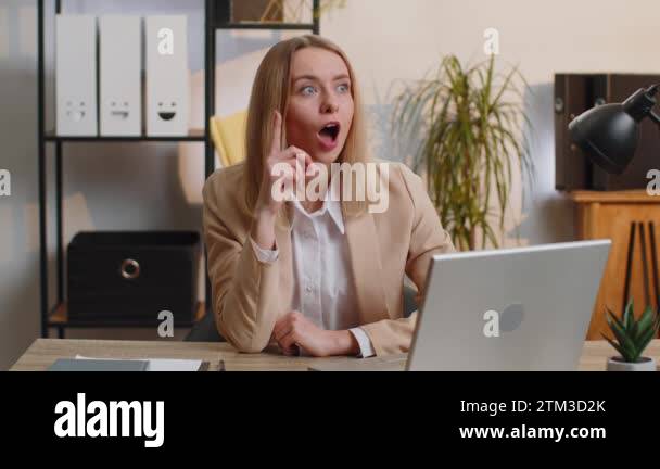 Excited amazed businesswoman touching head, showing explosion, looking ...