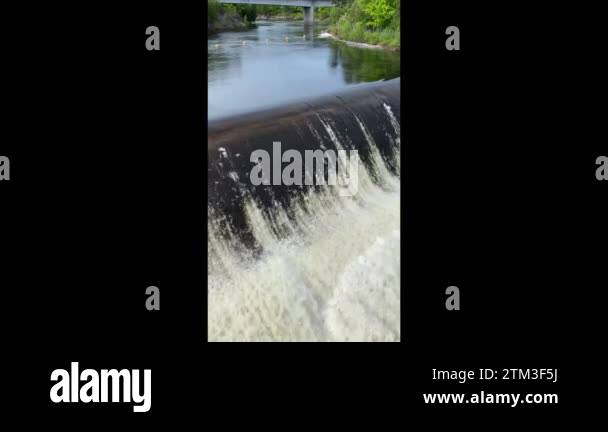 Laminar flow over dam above Montmorency Falls. Chute Montmorency large ...