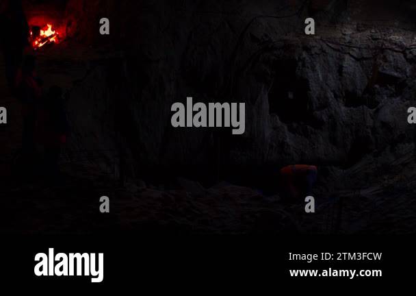 Night excavations in the pit. Archaeologists are excavating artifacts ...