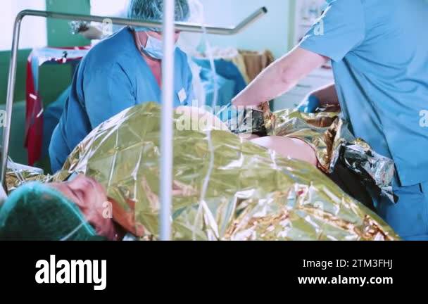 Team of doctors finishing the operation in the maternity hospital ...