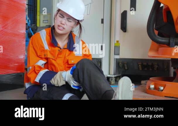 Young asian engineer woman injury with leg in factory industrial ...