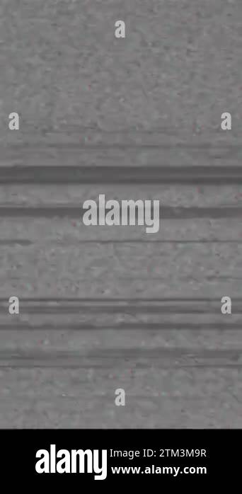 Vertical video. Retro glitch static noise. VHS tape rewind. Real analog ...