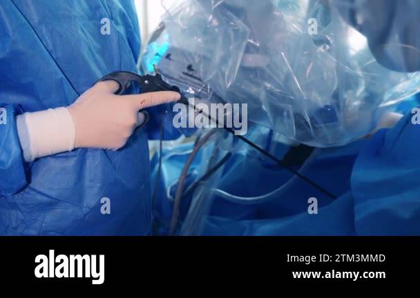 Surgeon operates robotic device in operating room. Modern medical ...