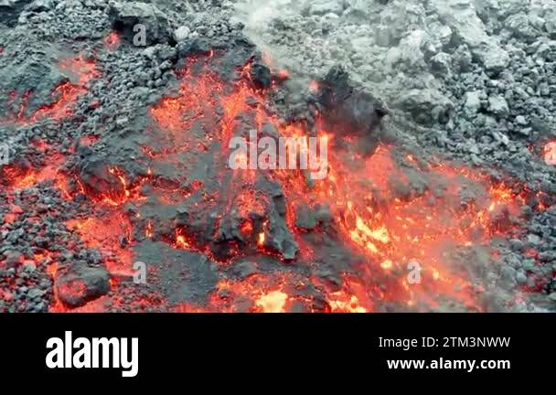 Cinematic steaming red glowing hot lava flow of the Mauna Loa volcano ...