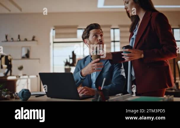 Woman bringing coffee colleague working together in morning office ...