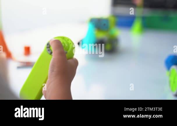 School student close up hand using joystick control panel technology ...
