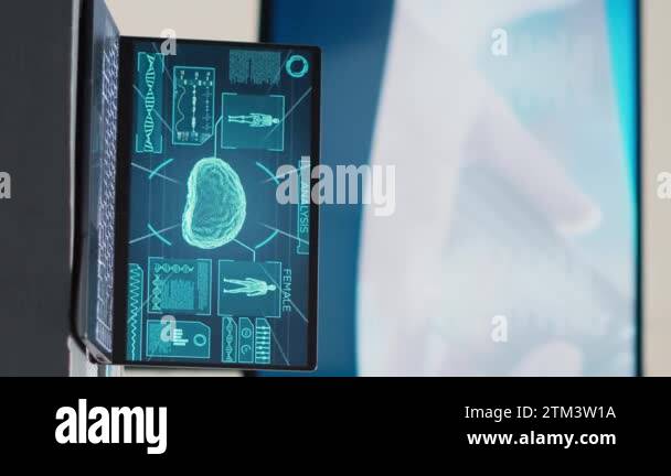 Vertical video: Registration desk with brain on laptop, showing ...