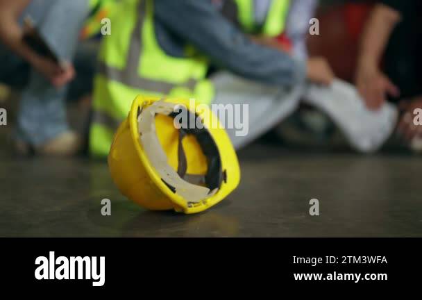 Warehouse staff having accident in factory, Young industrial worker ...