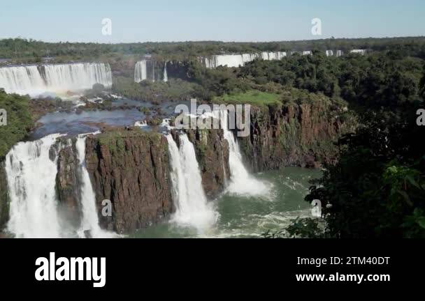 The Iguazu Falls are located at the border between Brazil and Argentina ...