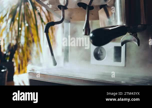 Start of coffee preparation. Steam wand on a espresso machine. Hot ...