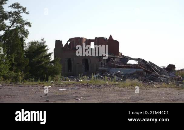 Traces of an artillery shell hitting a residential building. The roof ...