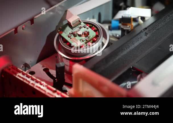 Close-up video head in progress with video cassettes inside VHS video ...