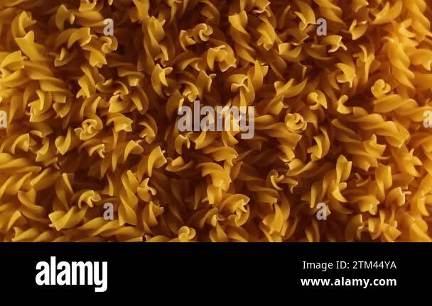 Uncooked Fusilli Pasta - Top View. Fat and Unhealthy Food. Dry Spiral ...
