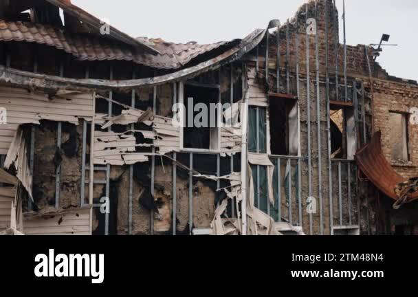 concrete building, damaged by shelling, destroyed city. Sad scene ...