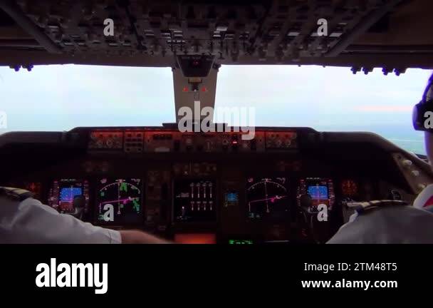 pilots adjusting flight parameters of the plane during the flight at ...