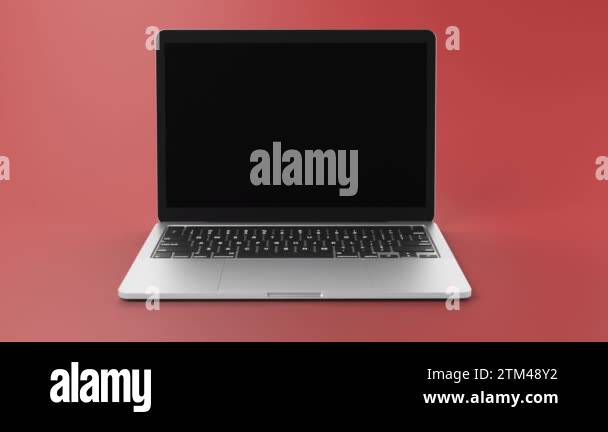 Modern Laptop slide into frame and opens with a green screen on display ...