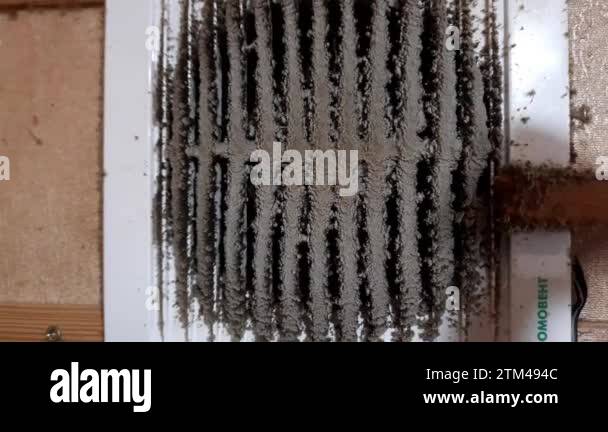 Close-up of a very dirty kitchen exhaust fan. Fan before preventive ...