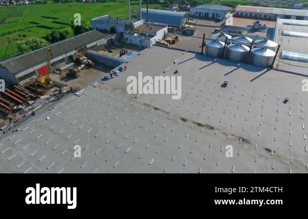 Construction on a rooftop. Building the solar farm on flat roof ...