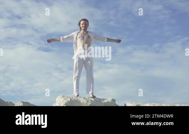 Man opens his arms to the wind and looks into the room with a smile ...