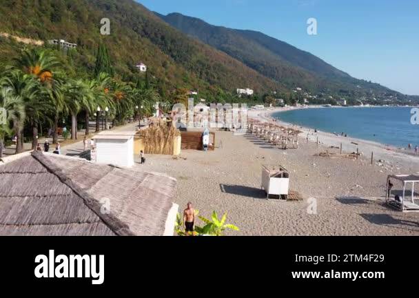 Drone shooting of the beach, the black sea, the city of Gagra, white ...