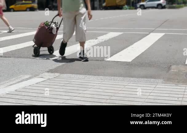 low angle view to the asphalt street at the crossing intersection while ...