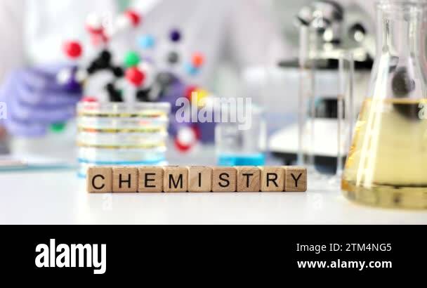 Word chemistry on laboratory table with microscope, laboratory ...