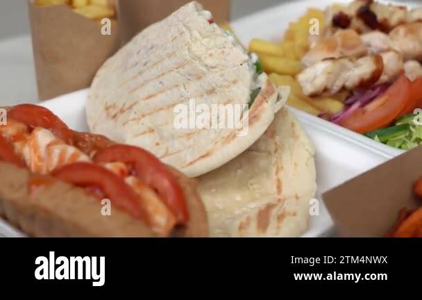 Traditional Greek fast food served on table in a cafe. Gyros sandwich ...