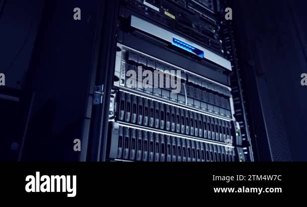 Dark server room in a modern data center. Powerful servers, looped ...