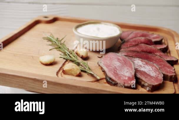 Sliced Beef Meat. Rare medium cooked beef with garlic and rosemary ...