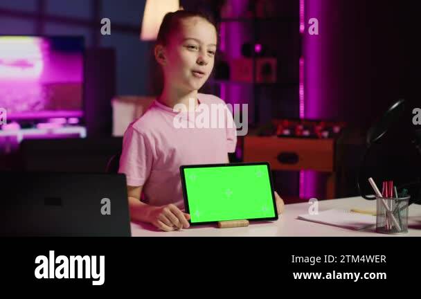 Cute child content creator filming technology review of newly released ...