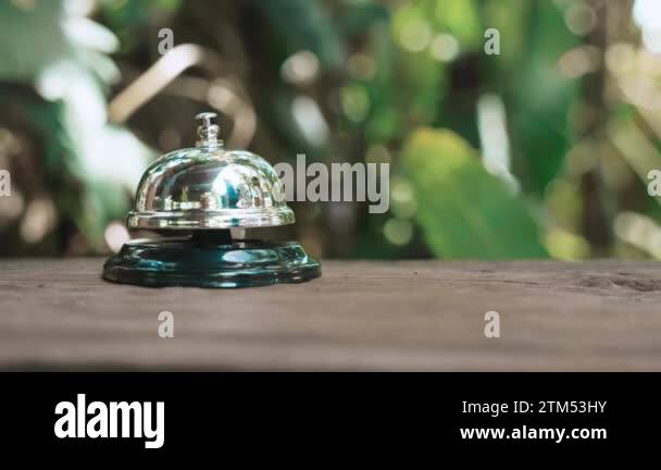 Hospitality hotel. Customer hand ringing service bell at coffee cafe ...