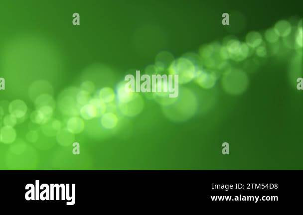 Defocused green bokeh lights background. This elegant motion animation with bokeh sphere ...