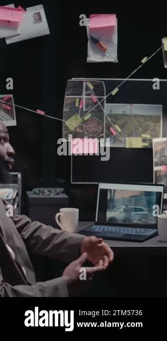 Vertical video: Police agents doing background checks for investigation ...