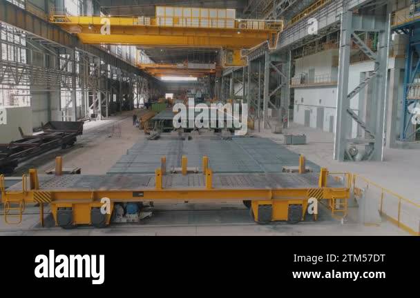 The beam crane carries a large load. Crane beam in the factory shop ...