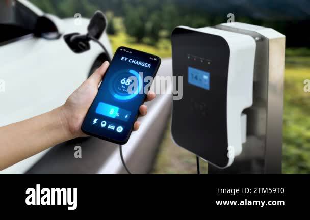 Businessman holding smartphone display battery status interface by ...