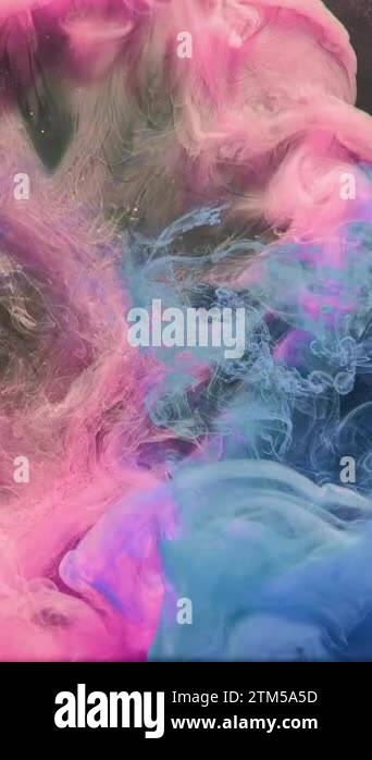 Vertical video. Paint splash. Ink water. Reveal effect. Explosion vapor. Pink blue color smoke ...
