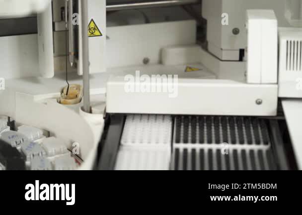 A close-up of automated chemistry analyzing process in medical ...