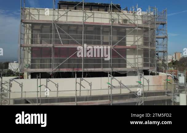 The facade of the Tall high-rise building under construction with ...