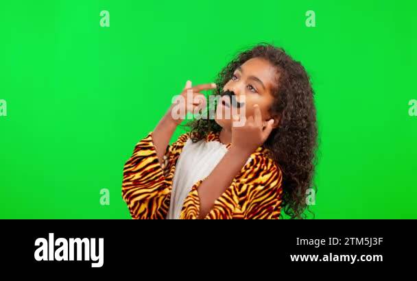 Mustache, silly and costume with child in green screen studio for hipster, comic and disguise ...