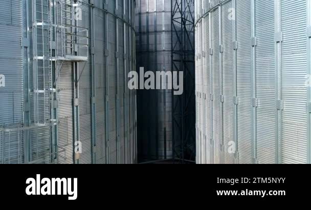 Large metal silo for storing grain. Modern industrial plant. Granary ...