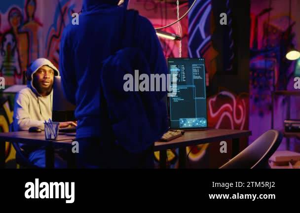 Asian hacker arriving in underground bunker, ready to do data breaches ...