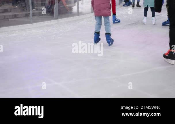 ice skating, details legs, Close up. During cold winter season, people ...