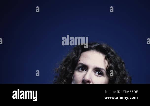 Young woman opening eyes and thinking deeply about creative idea. 20s ...