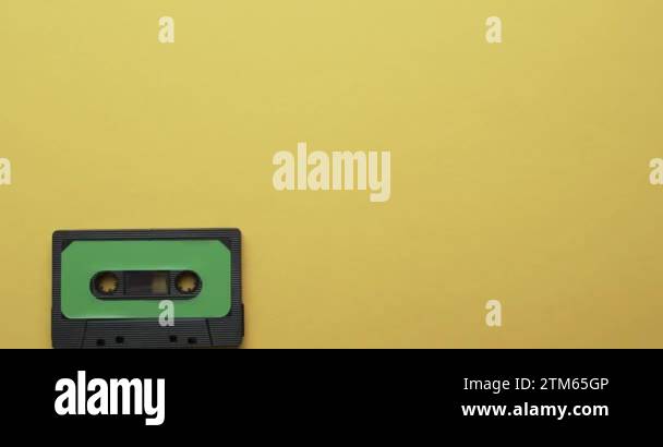 Video of retro tape with green label with copy space on yellow ...