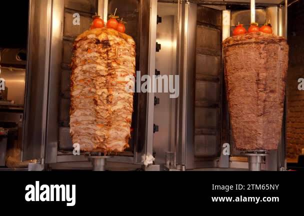 Meat on spit for Shawarma. Meat on grill. Cooking. Doner Traditional ...