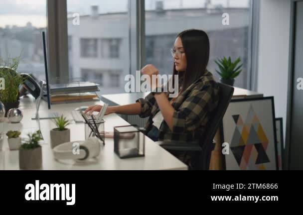 Focused woman texting keyboard at office closeup. Overworked copywriter ...