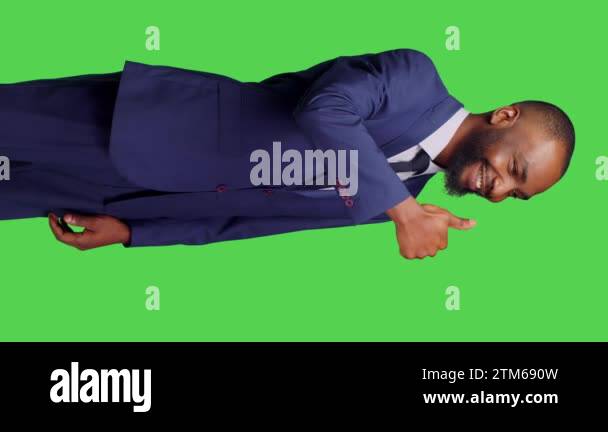 Vertical video: Side view of male employee showing thumbs up sign on ...