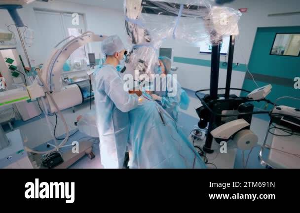 Medical process in the modern operating theatre. Surgeons performing ...